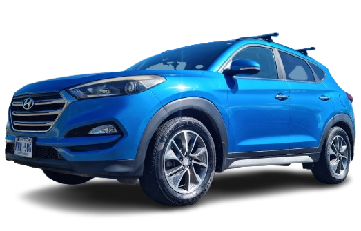 Side view of a blue Hyundai Tucson, model year 2017 in front of a ...