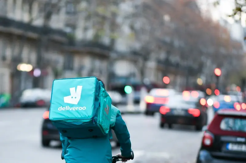 Takeaway firm Deliveroo rallies on trimmed annual loss and positive ...